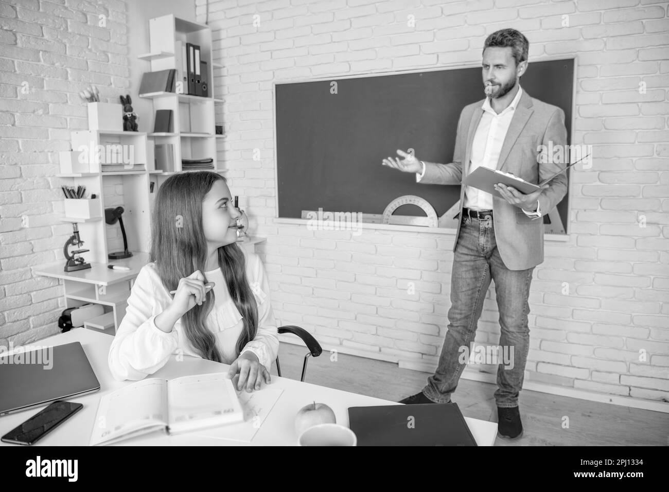 positive child study in classroom with teacher. selective focus Stock ...