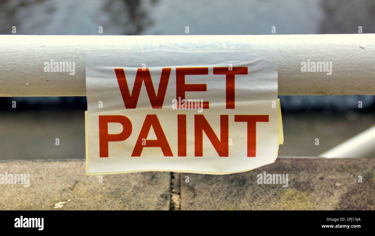 red and white wet paint sign Stock Photo - Alamy