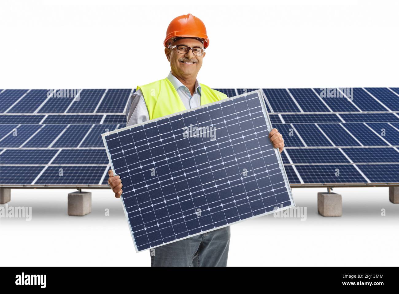 Mature male engineer holding a solar panel and smiling isolated on ...