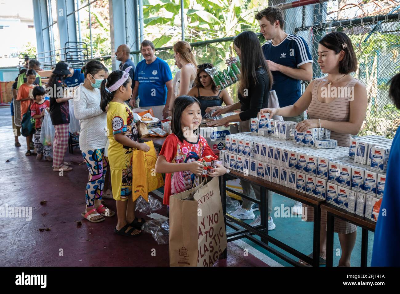 A young resident of an underprivileged community, in the Klong Toey ...