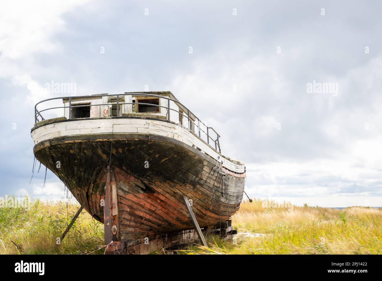Old derelict wooden ship wreck closeup. Back side of an old abandoned ...