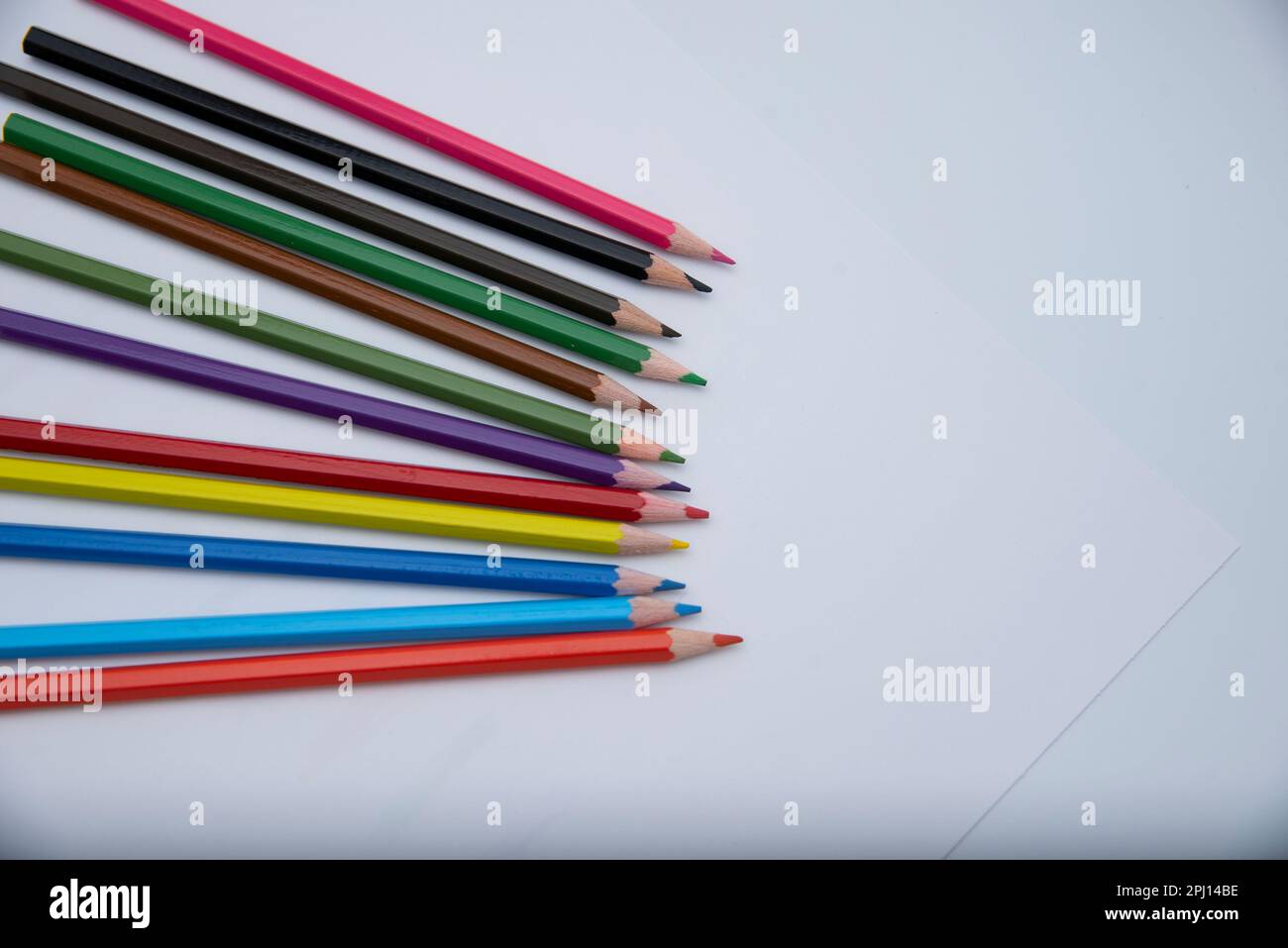 Colored pencils for drawing and coloring, on a white background ...