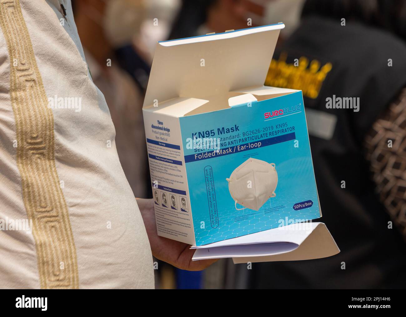 An official from Chiang Mai Municipality holds the KN95 facial mask box ...