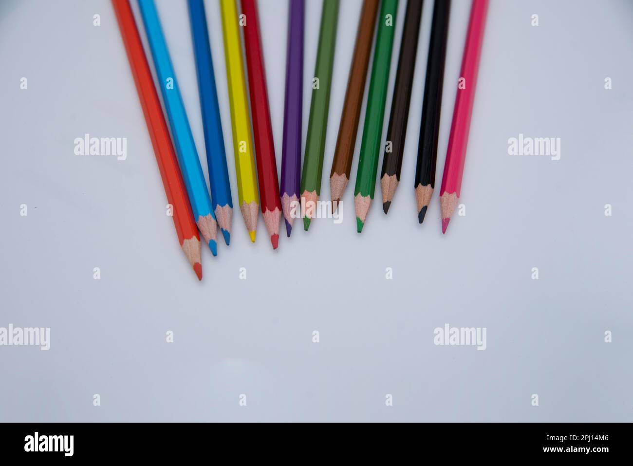 Colored pencils for drawing and coloring, on a white background ...