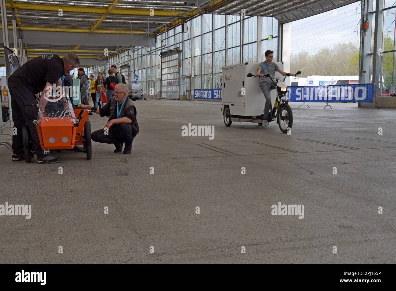 People testing electric assist load carrying bikes on display at the ...
