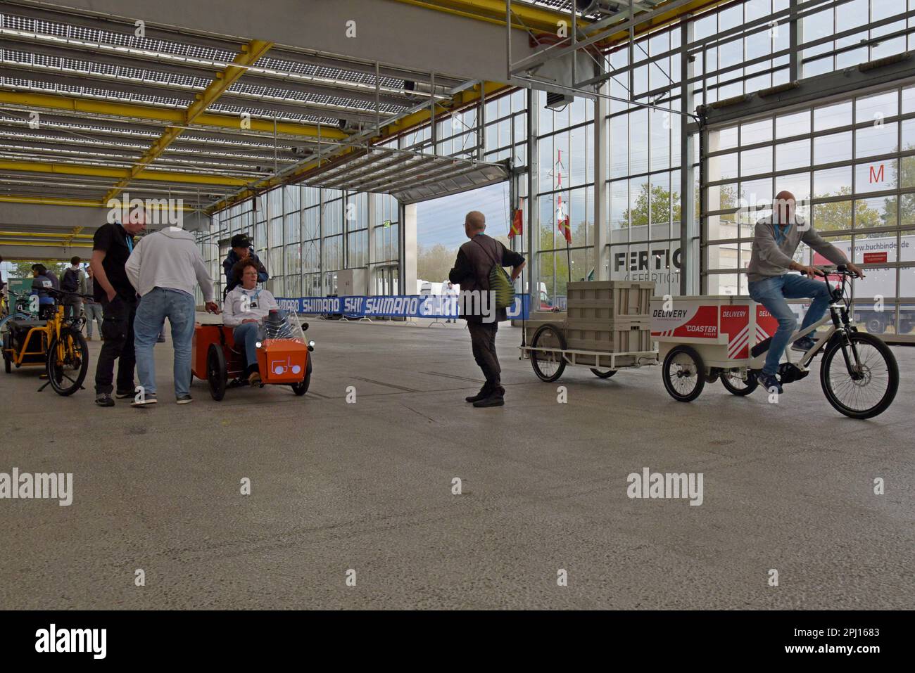 People testing electric assist load carrying bikes on display at the ...