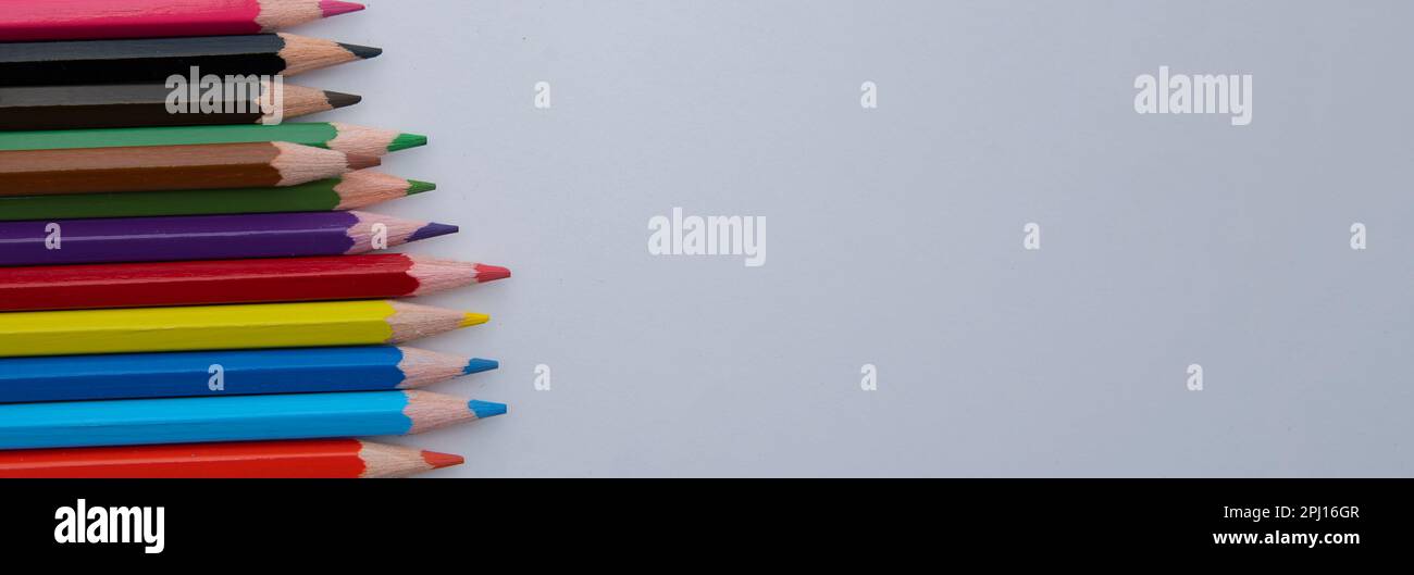 Colored pencils for drawing and coloring, on a white background ...