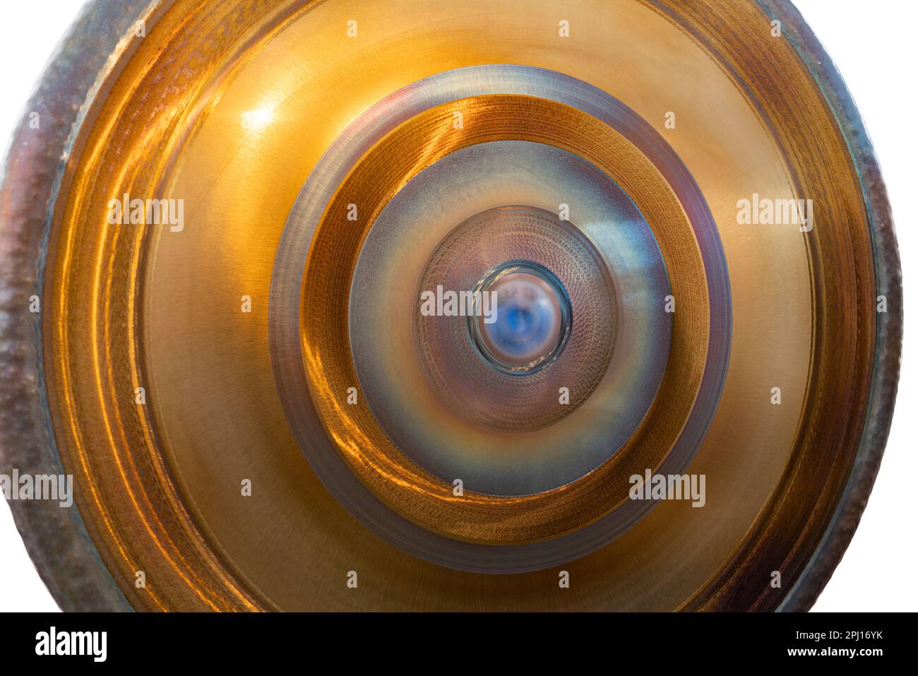 Abstract closeup shot of a colorful metallic asian gong in white back ...