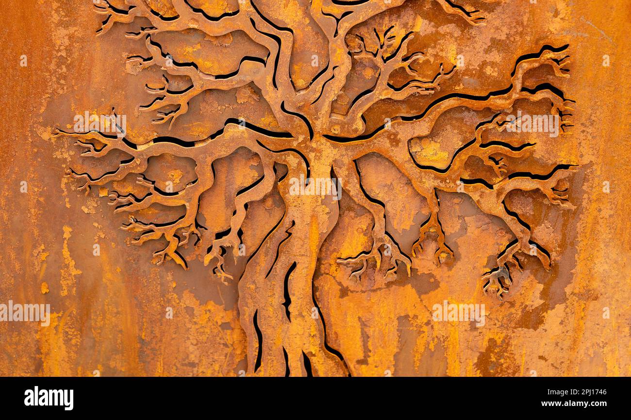 Tree ornament cut out of a rusty metal plate Stock Photo - Alamy