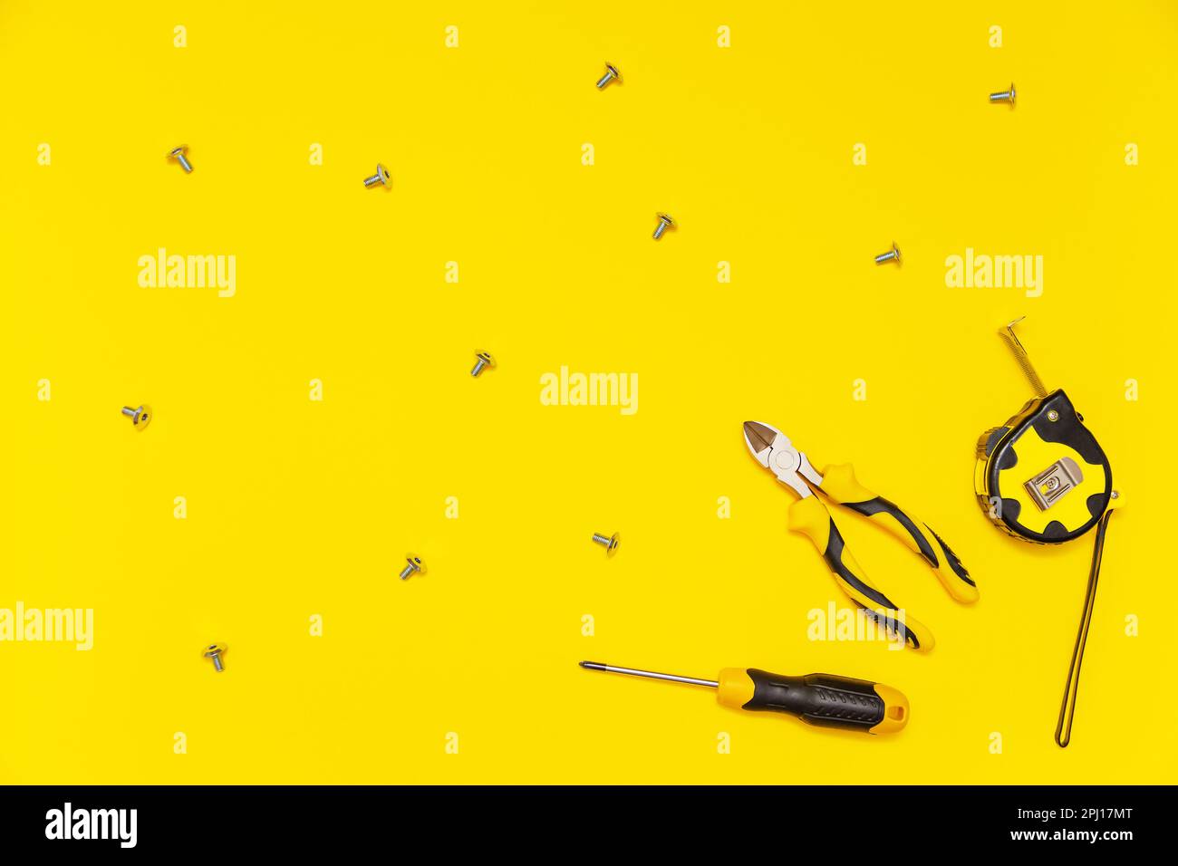 Set of bench tools, screwdriver, cutting pliers, tape measure and ...