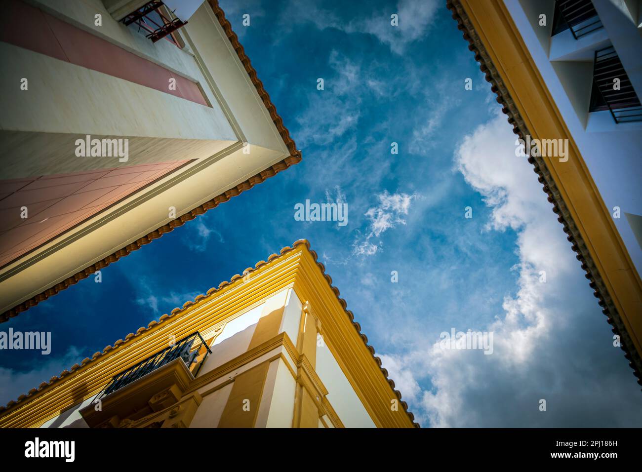 Low angle view of the corner of three historic buildings in the city of ...