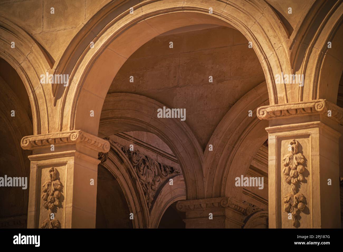 Play of light with the semicircular arches of the cloister of the ...