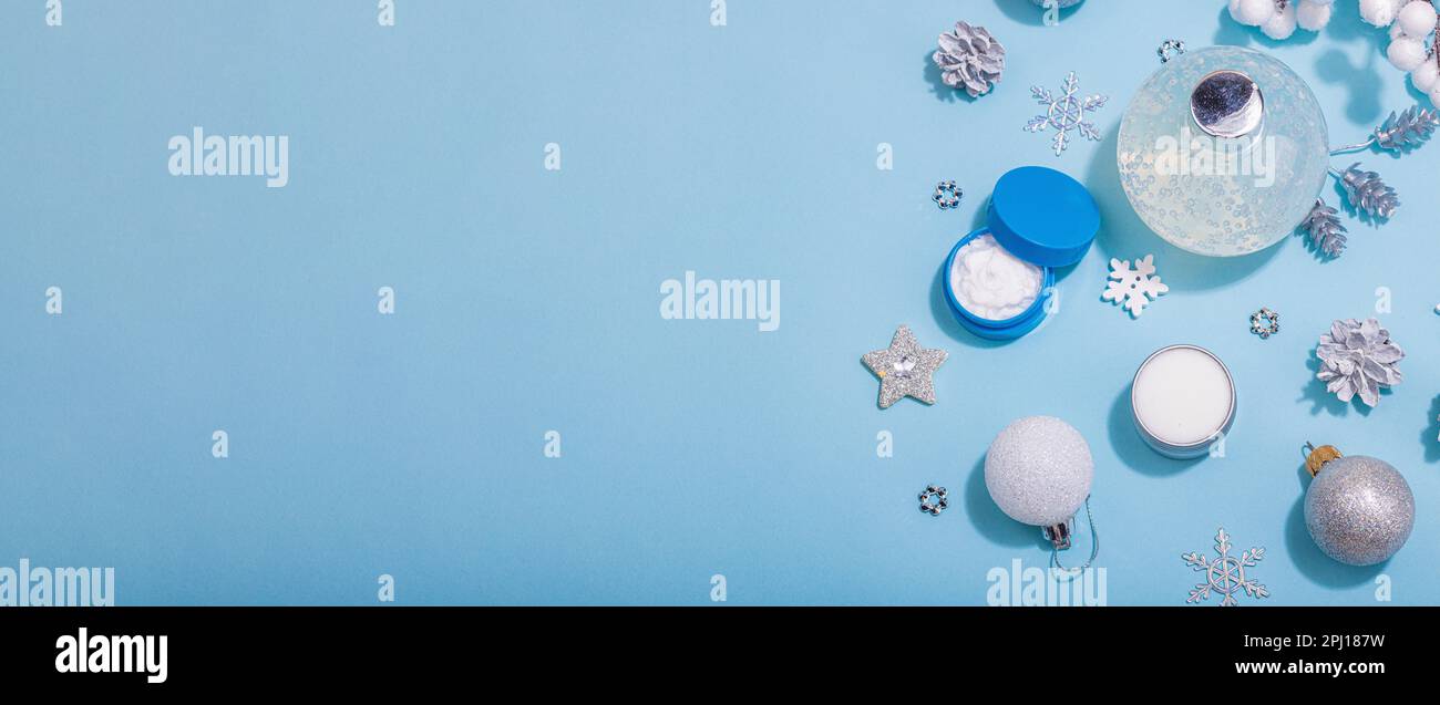 Winter season skin care cosmetics concept. Set with moisturizing lotion ...