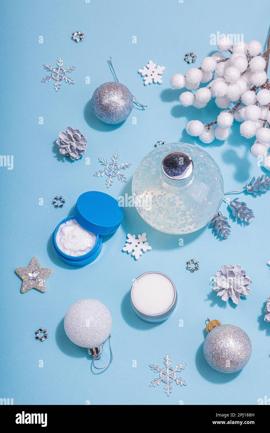 Winter season skin care cosmetics concept. Set with moisturizing lotion ...