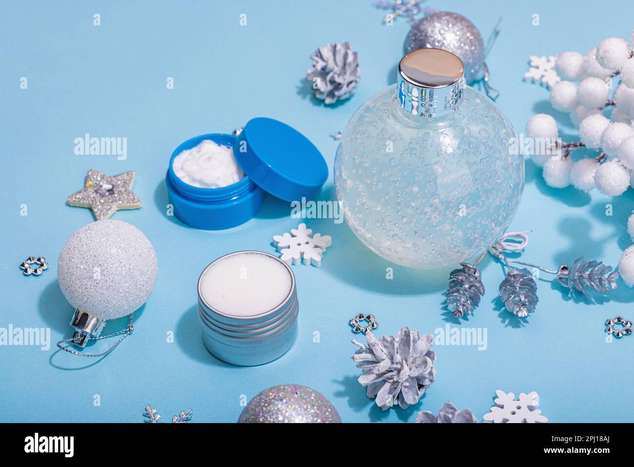 Winter season skin care cosmetics concept. Set with moisturizing lotion ...