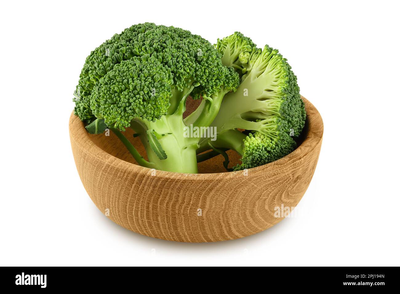 fresh broccoli in wooden bowl isolated on white background close-up ...