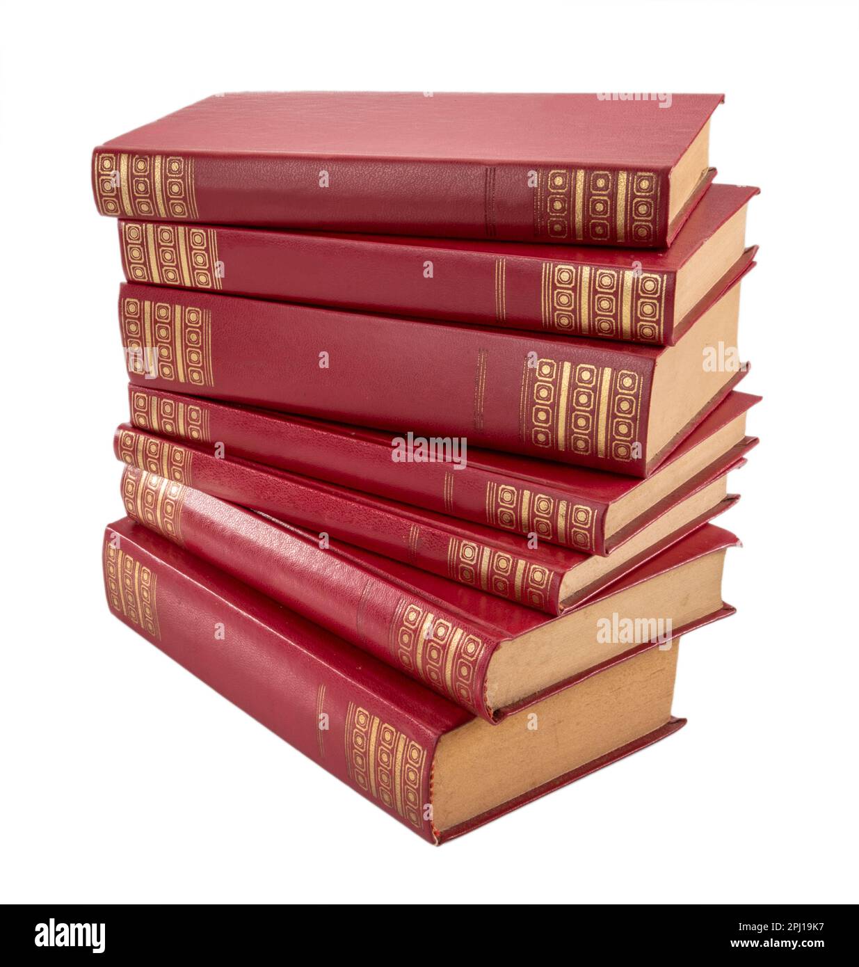 Stack of red vintage books with golden decorations on hard leather ...