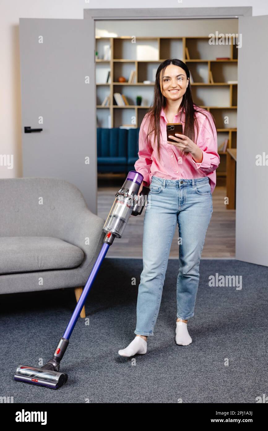Woman vacuuming floor using hi-res stock photography and images - Alamy