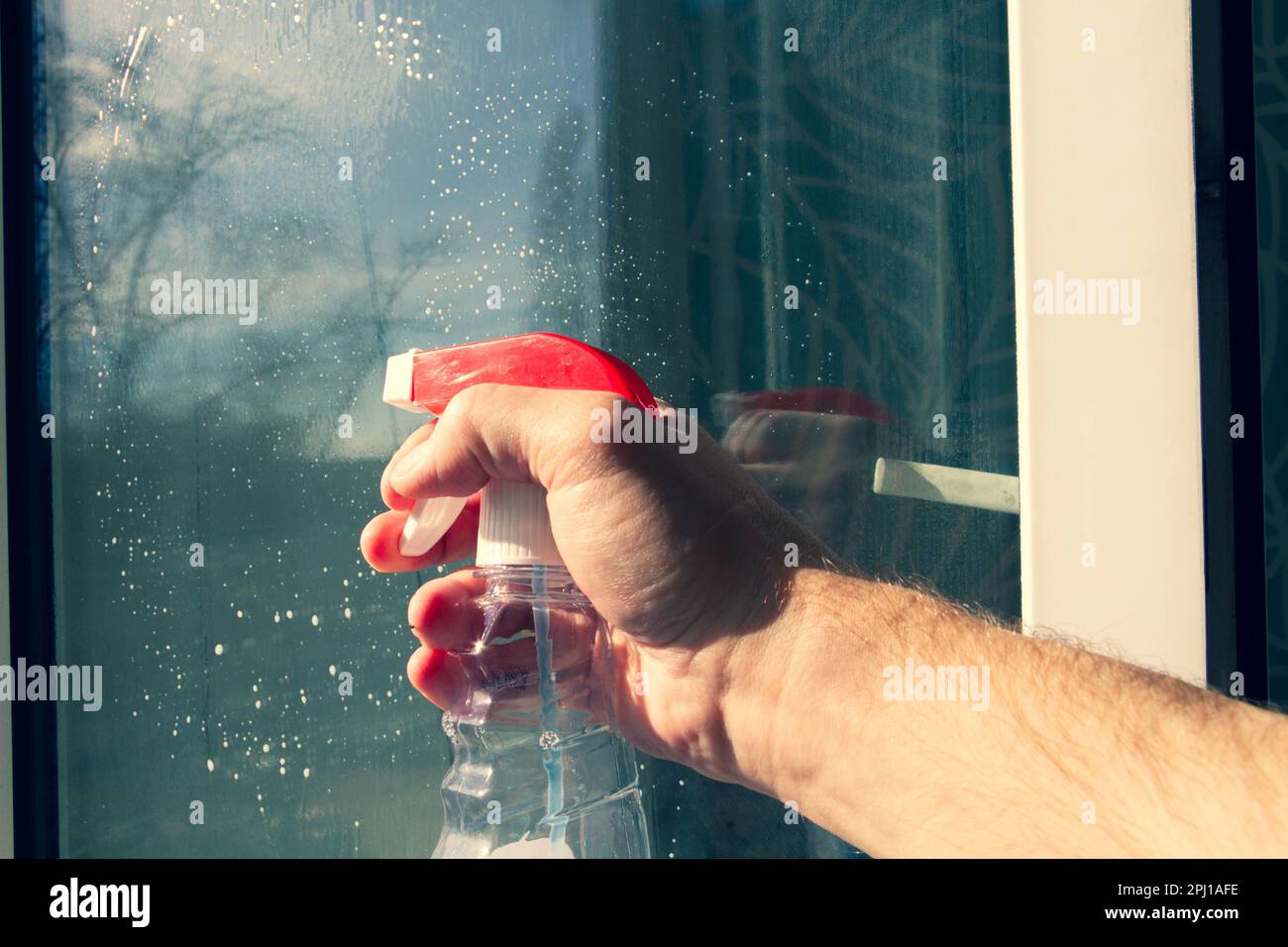 Window washing. Cleaning the window with a brush and foam. The concept ...