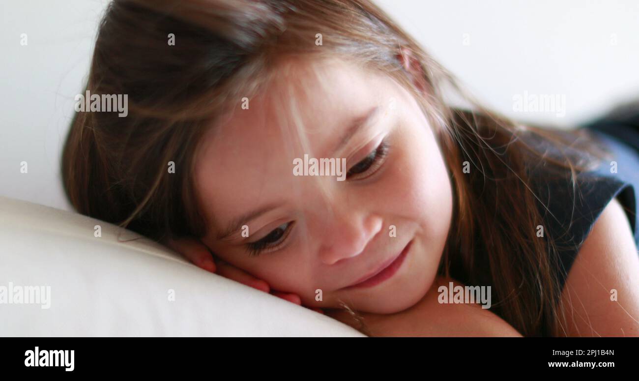 Pretty little girl smiling to camera. Real life child smile to camera ...
