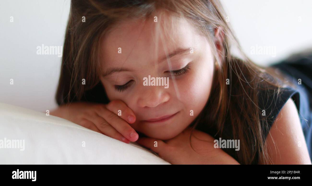 Pretty little girl smiling to camera. Real life child smile to camera ...