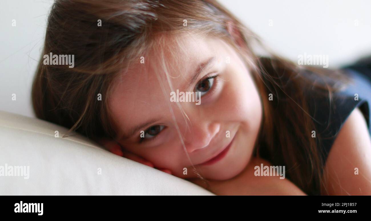 Pretty little girl smiling to camera. Real life child smile to camera ...