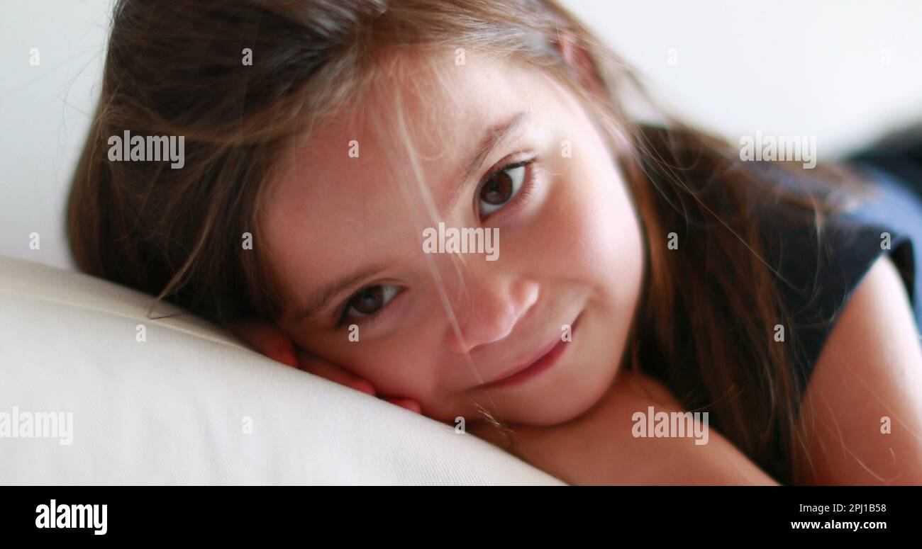 Pretty little girl smiling to camera. Real life child smile to camera ...