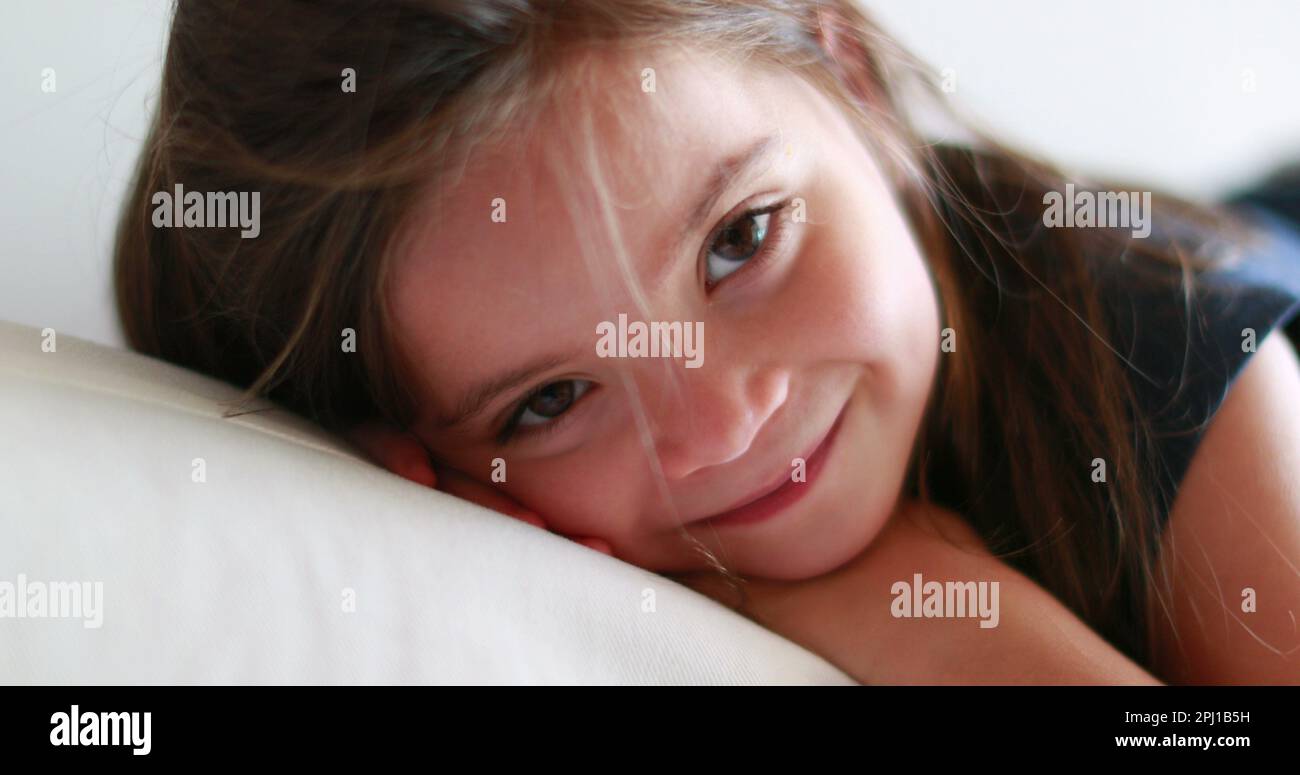 Pretty little girl smiling to camera. Real life child smile to camera ...