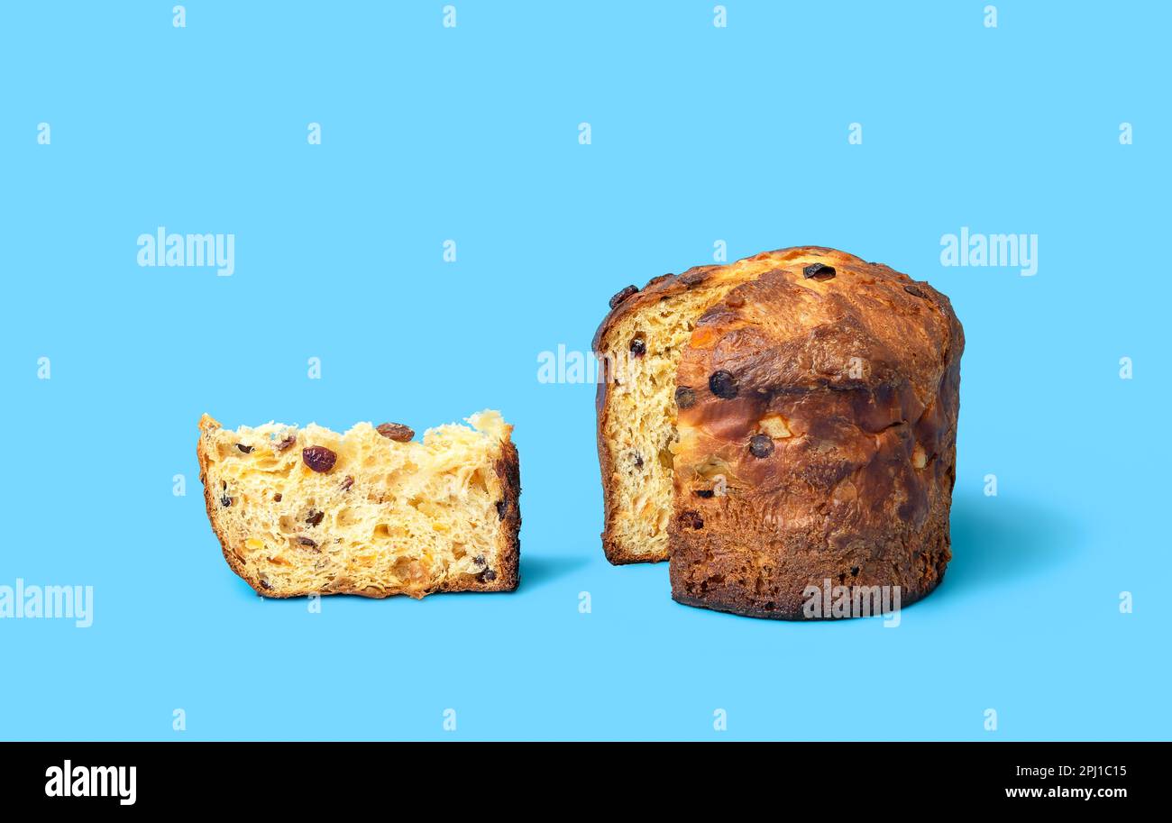 Homemade panettone minimalist on a blue table. Sliced panettone in ...