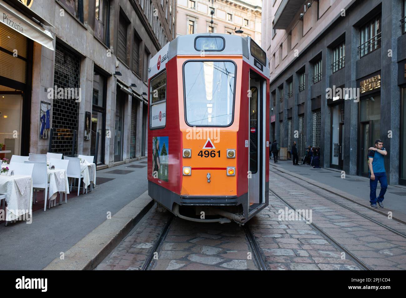 Street cars travel through the beautiful city of Milan, Italy Stock ...
