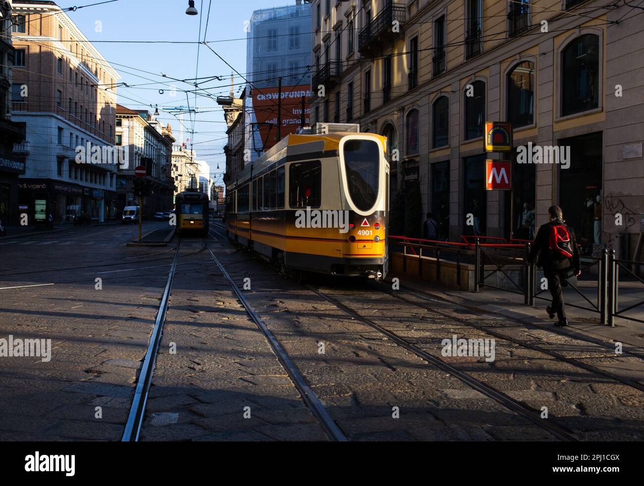 Street cars travel through the beautiful city of Milan, Italy Stock ...