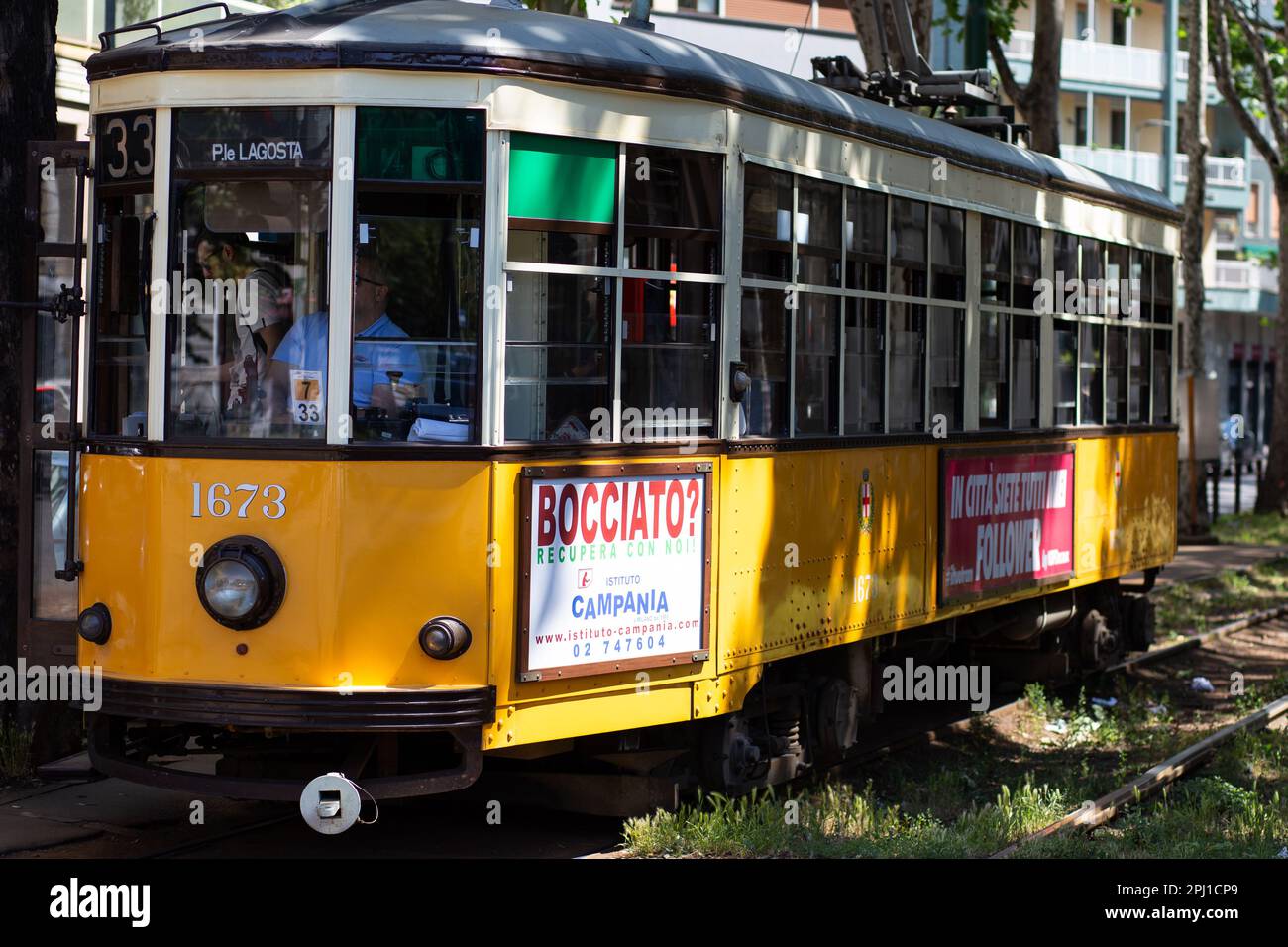 Street cars travel through the beautiful city of Milan, Italy Stock ...