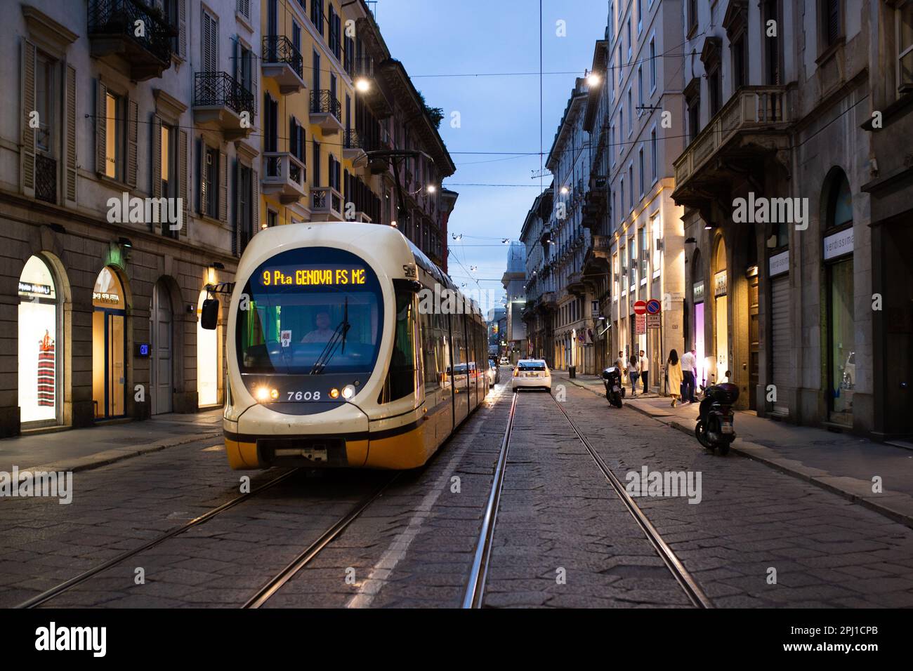 Street cars travel through the beautiful city of Milan, Italy Stock ...