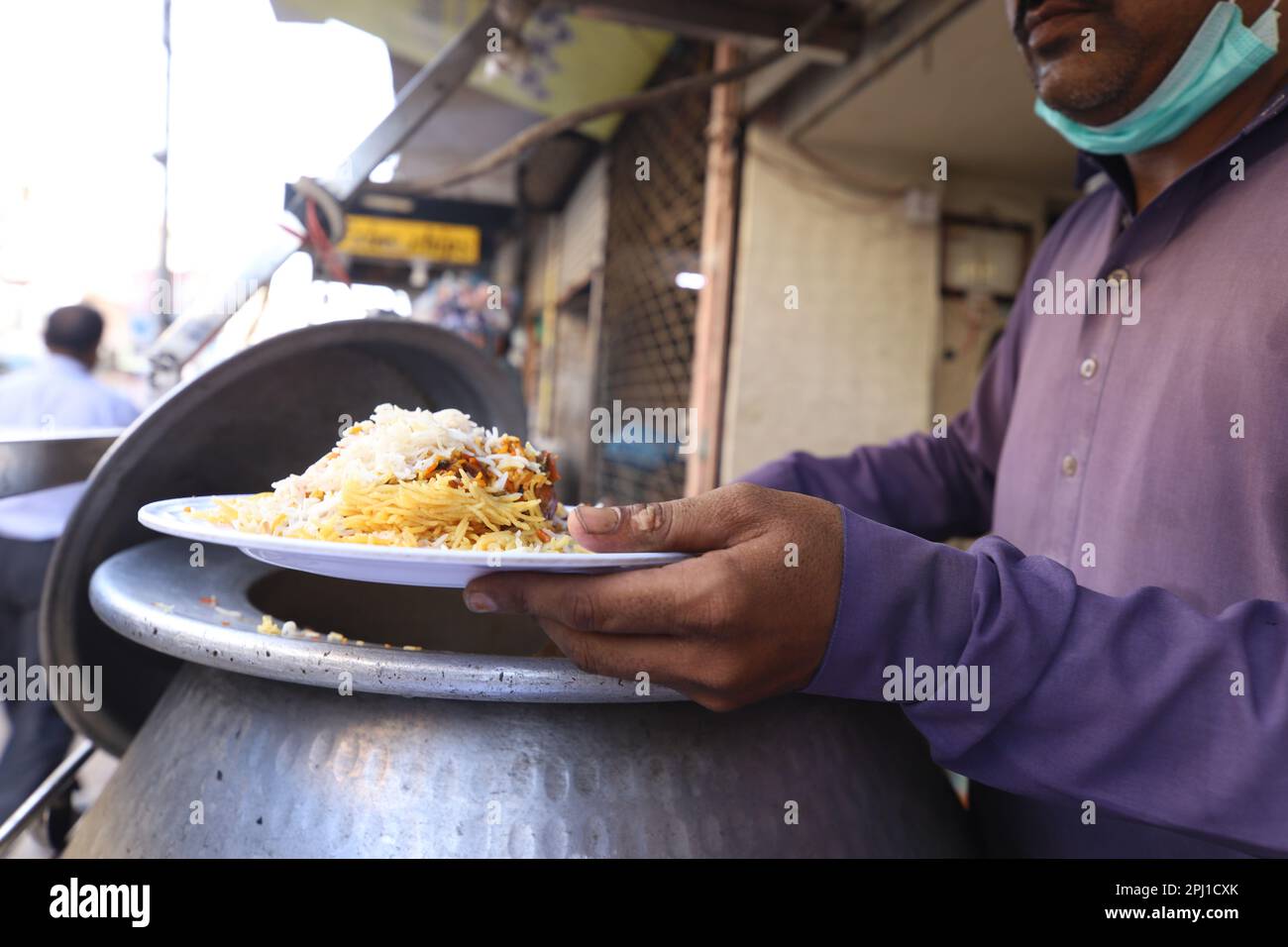 Burns Road march 2021, A young man selling biryani at famous and old ...