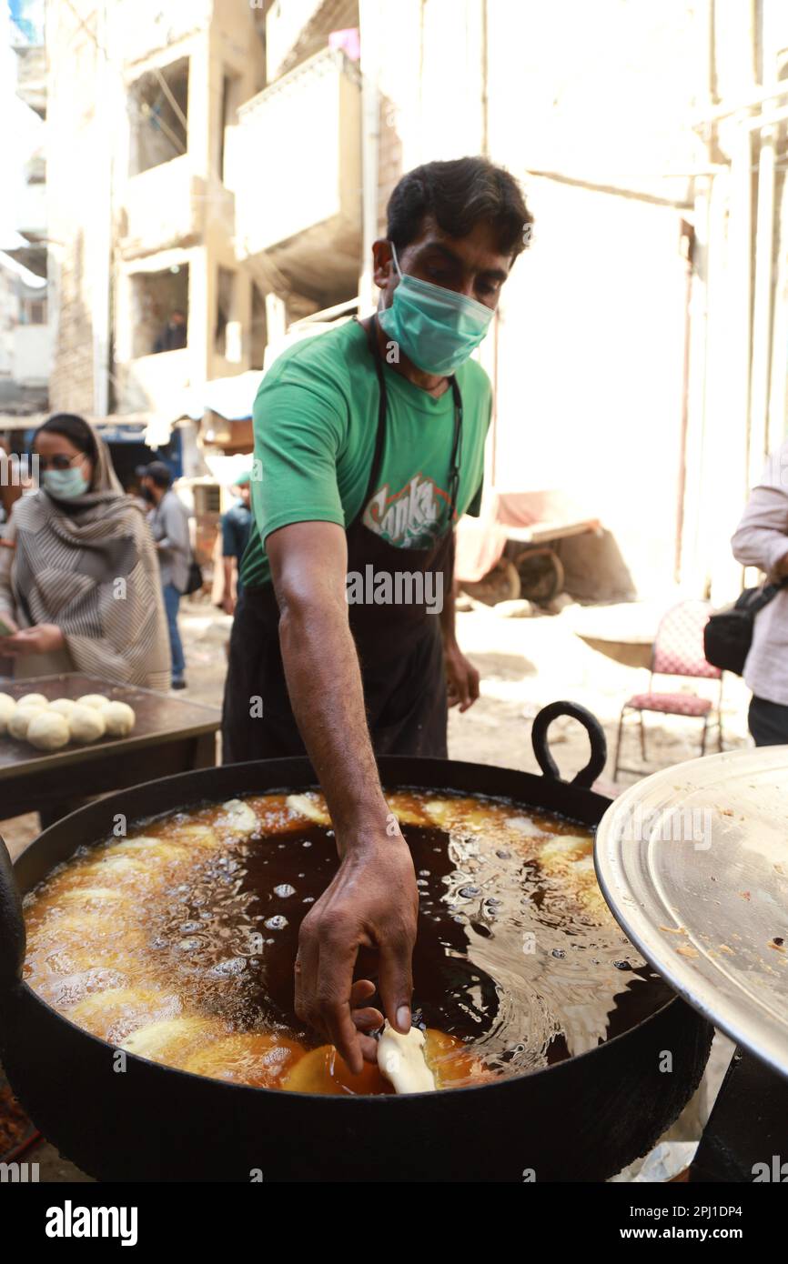 Pakistan eating hi-res stock photography and images - Alamy