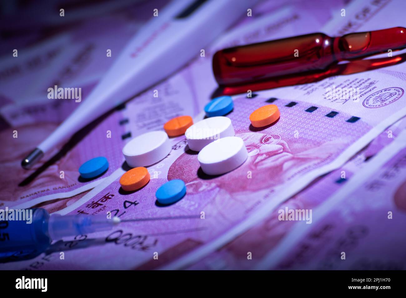 Closeup of medicine with indian paper currency, expensive medication ...