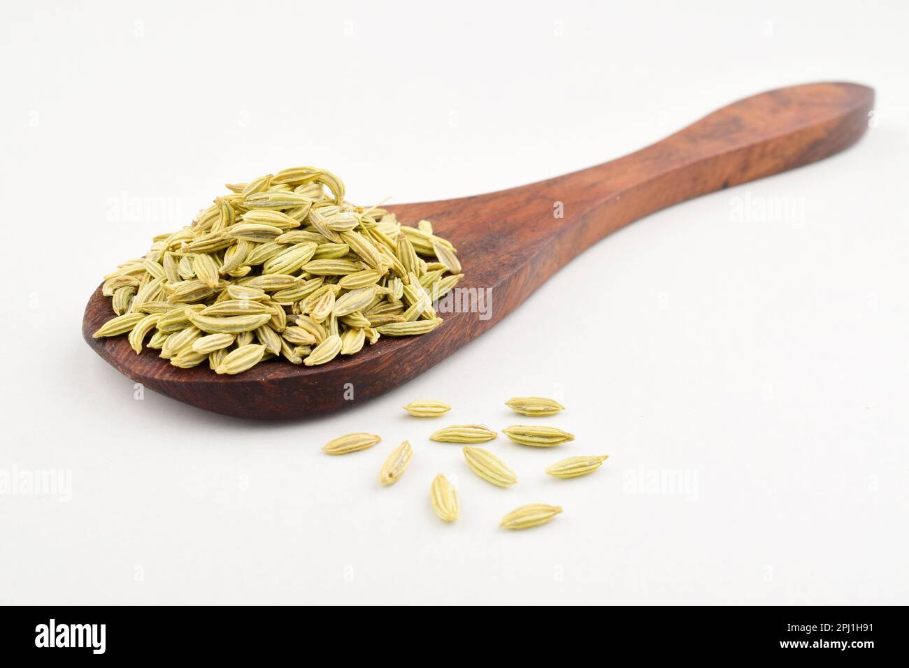 Closeup of fennel seeds on white background Stock Photo - Alamy