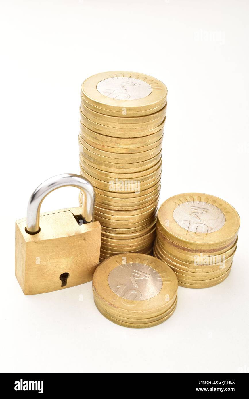 Padlock with indian currency coin on white background Stock Photo - Alamy