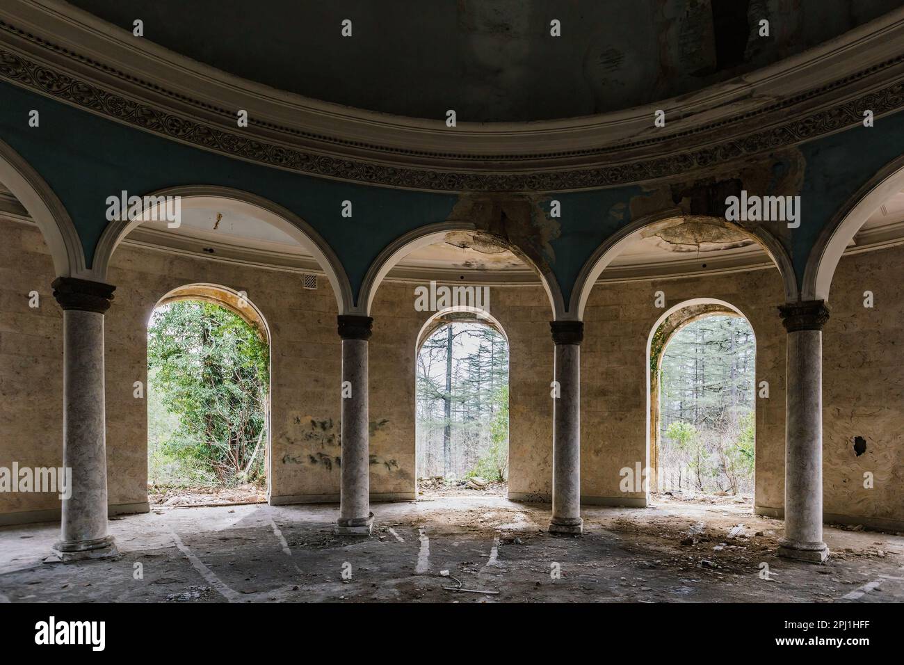 Round hall with colonnade in old abandoned palace Stock Photo - Alamy