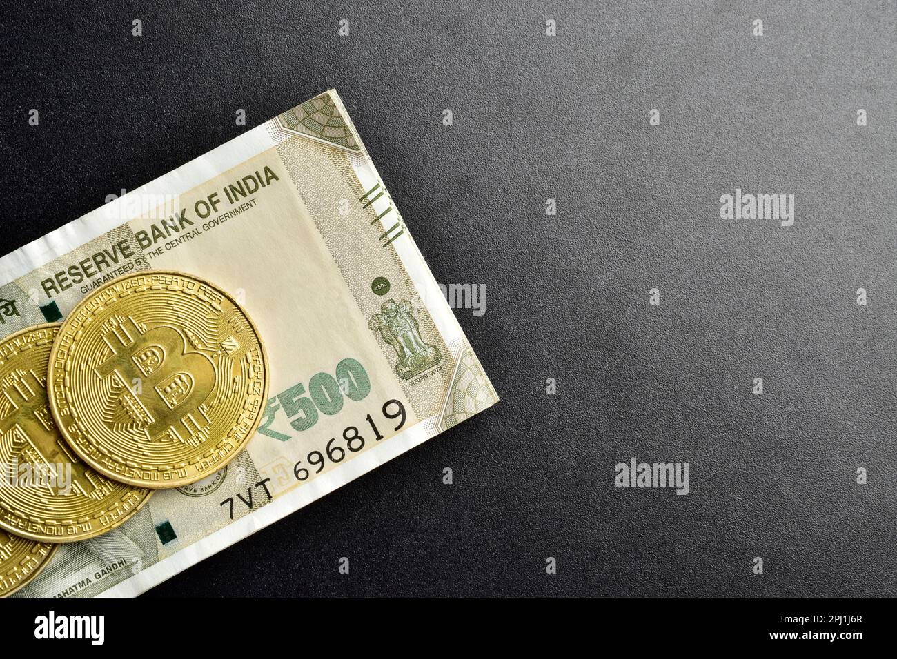 Top view of bitcoin with indian rupees Stock Photo - Alamy