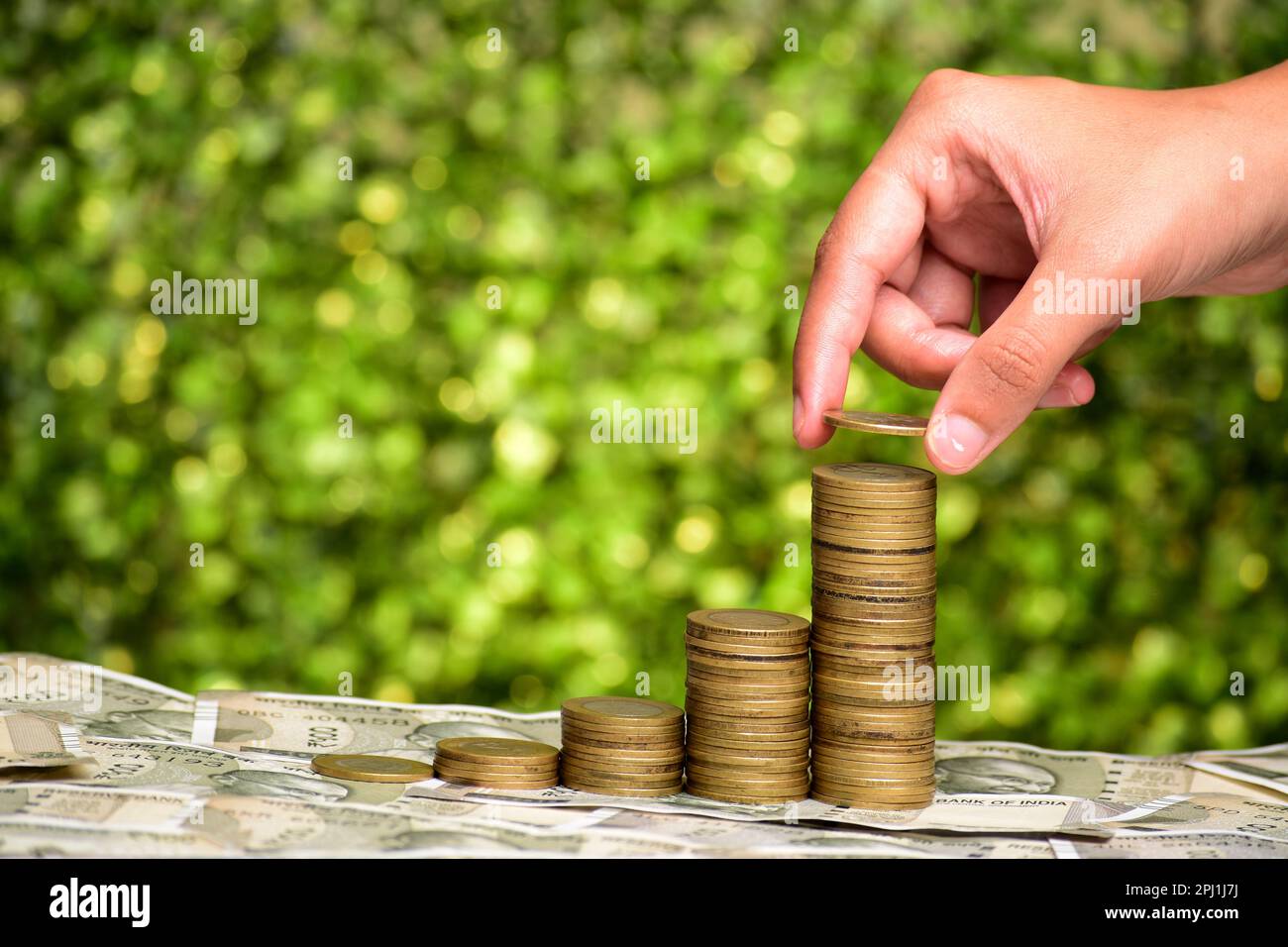 Hand putting coin on coin stack, wealth management concept Stock Photo ...