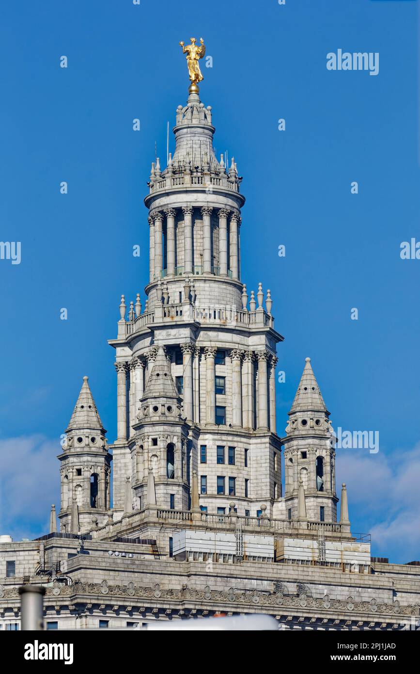 The Municipal Building’s white Beaux Arts form contrasts with the blue ...