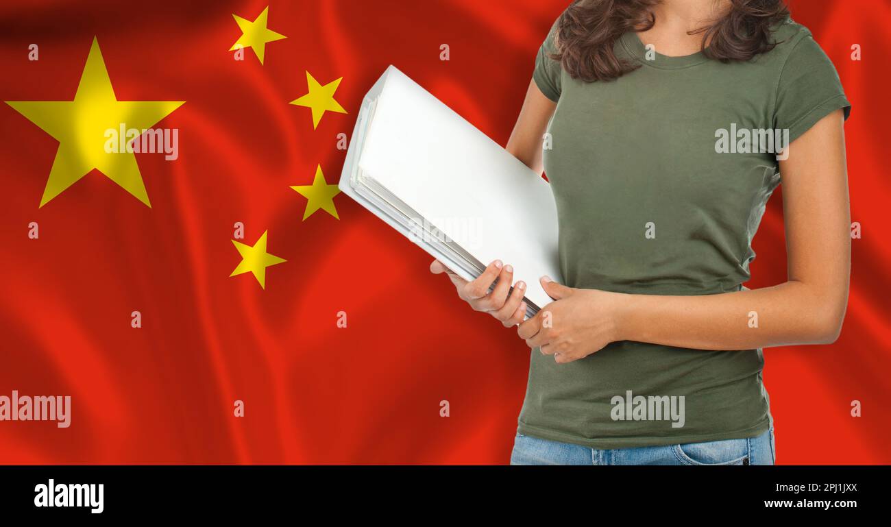 Half-length portrait of a female student with a folder. Foreign ...