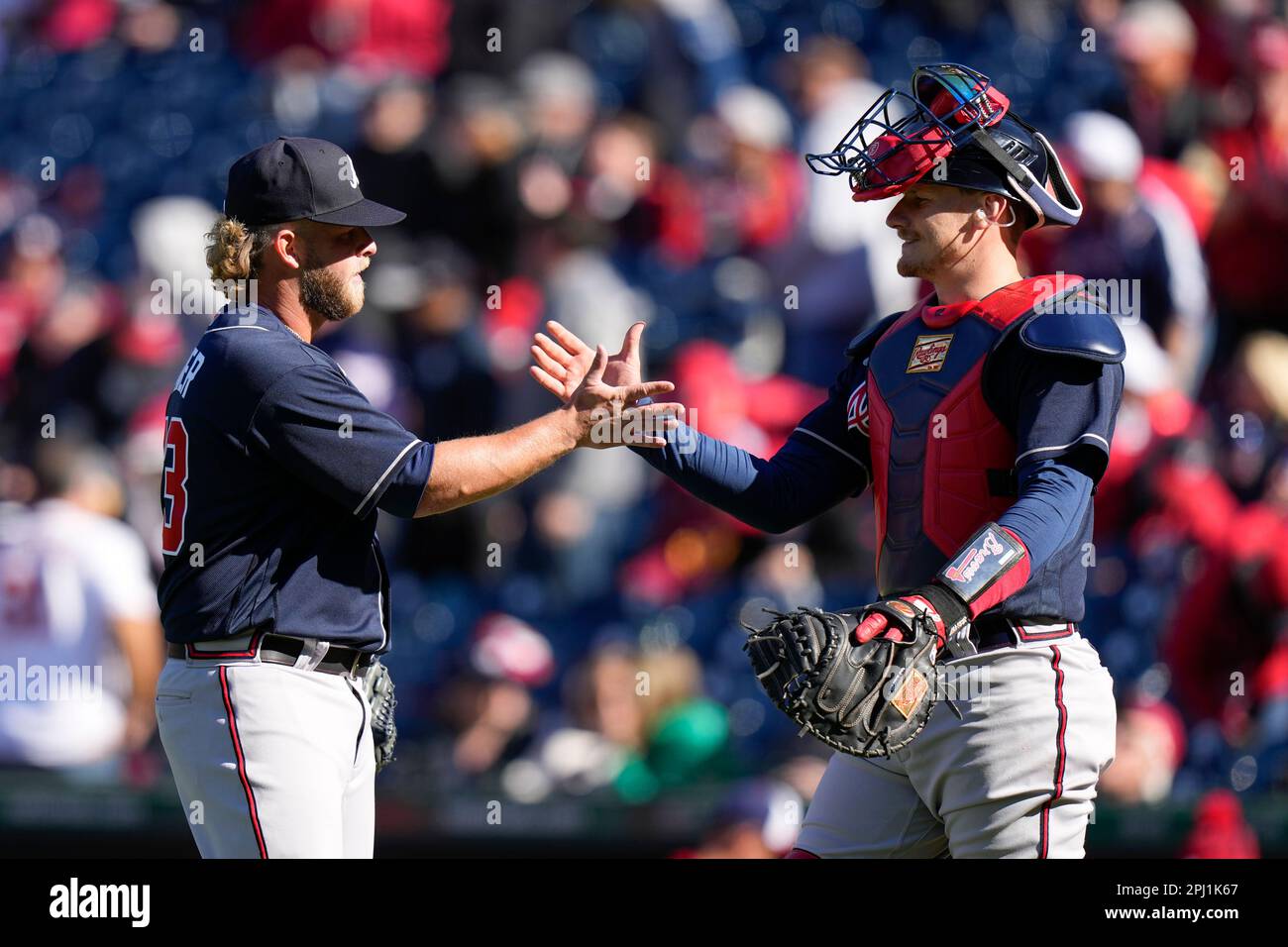 Atlanta Braves relief pitcher A.J. Minter, left, and catcher Sean ...