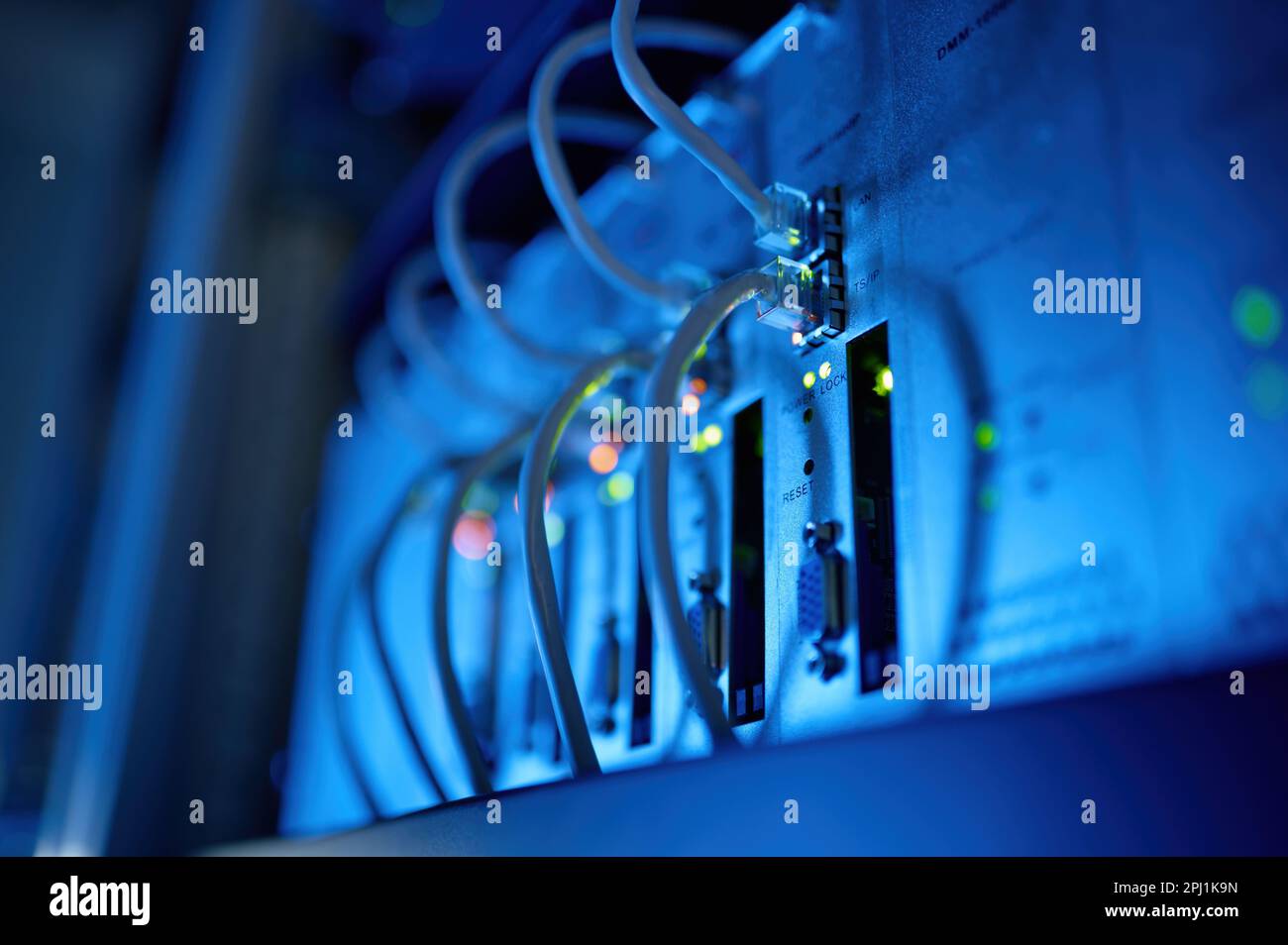 Closeup network server room with fiber optic hub Stock Photo - Alamy