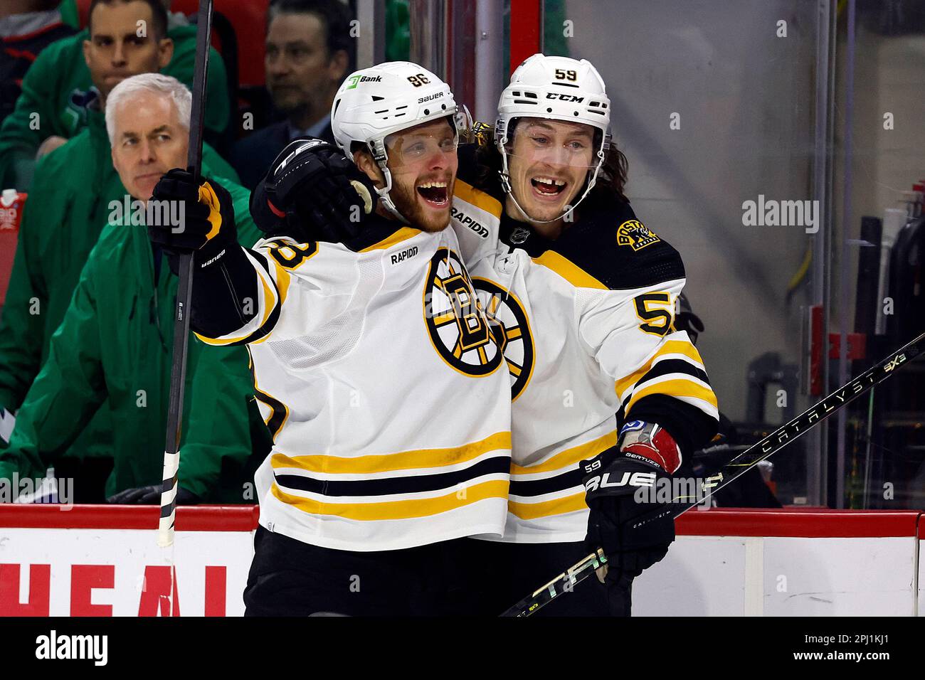 Boston Bruins' David Pastrnak (88) celebrates his goal with teammate ...