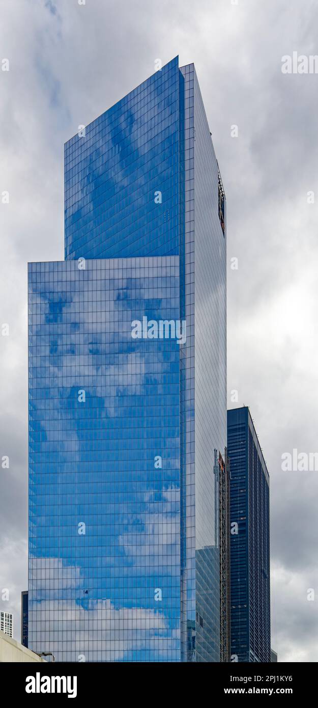4 World Trade Center, with its highly reflective glass curtain wall ...