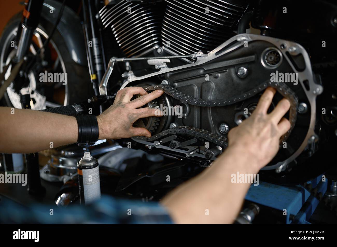 Man mechanic fixing motorcycle engine working at garage workshop Stock ...