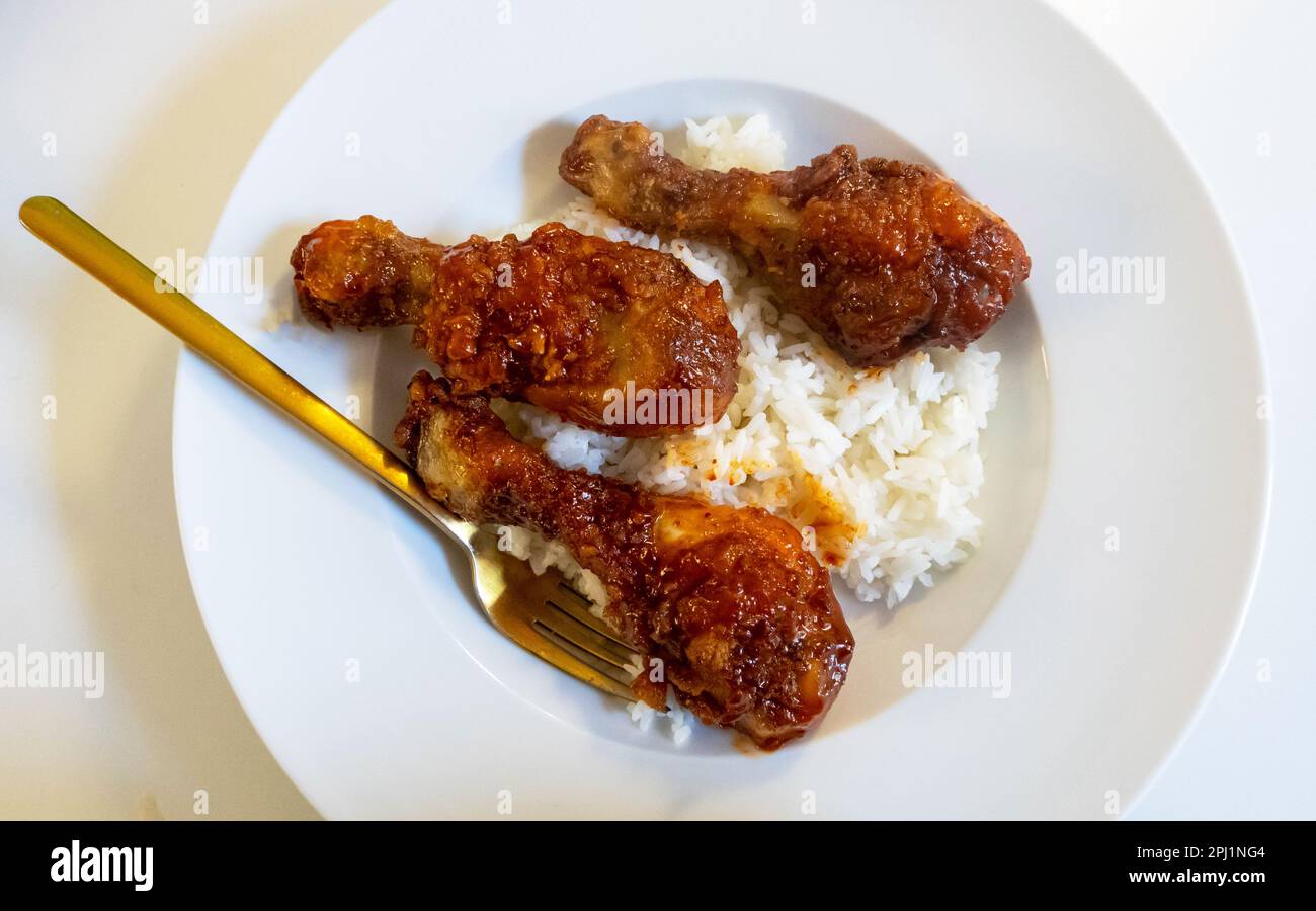 Roasted chicken legs (drumsticks) and white rice Stock Photo - Alamy