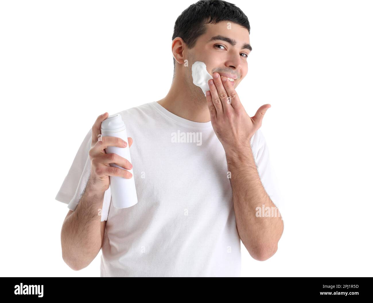 Young man applying shaving foam on face against white background Stock Photo - Alamy